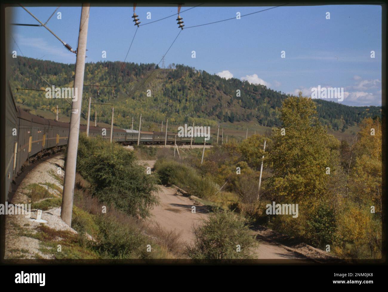 The Trans-Siberian train travels east along the Khilok River near ...