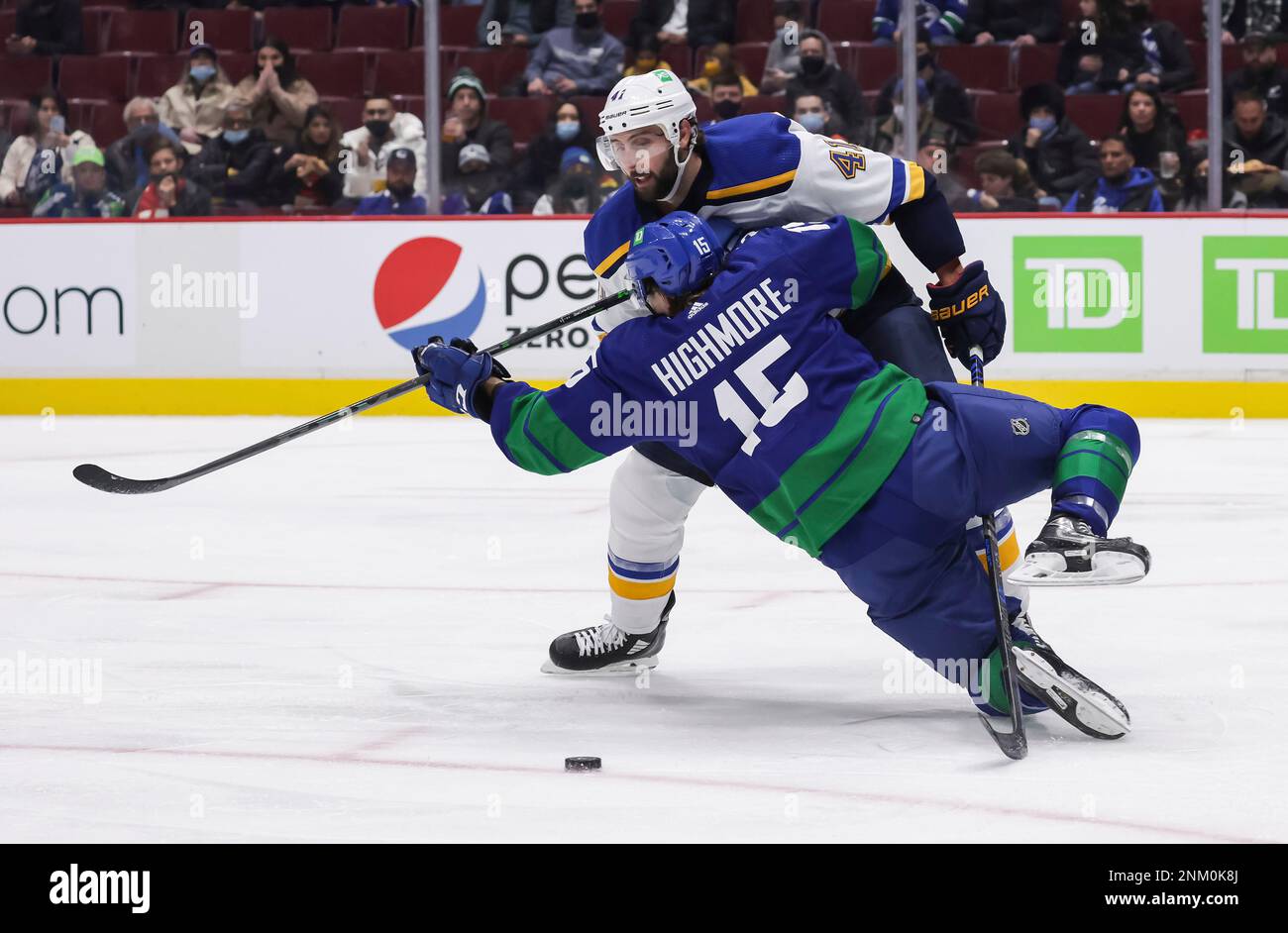 St. Louis Blues' Robert Bortuzzo, back, checks Vancouver Canucks ...