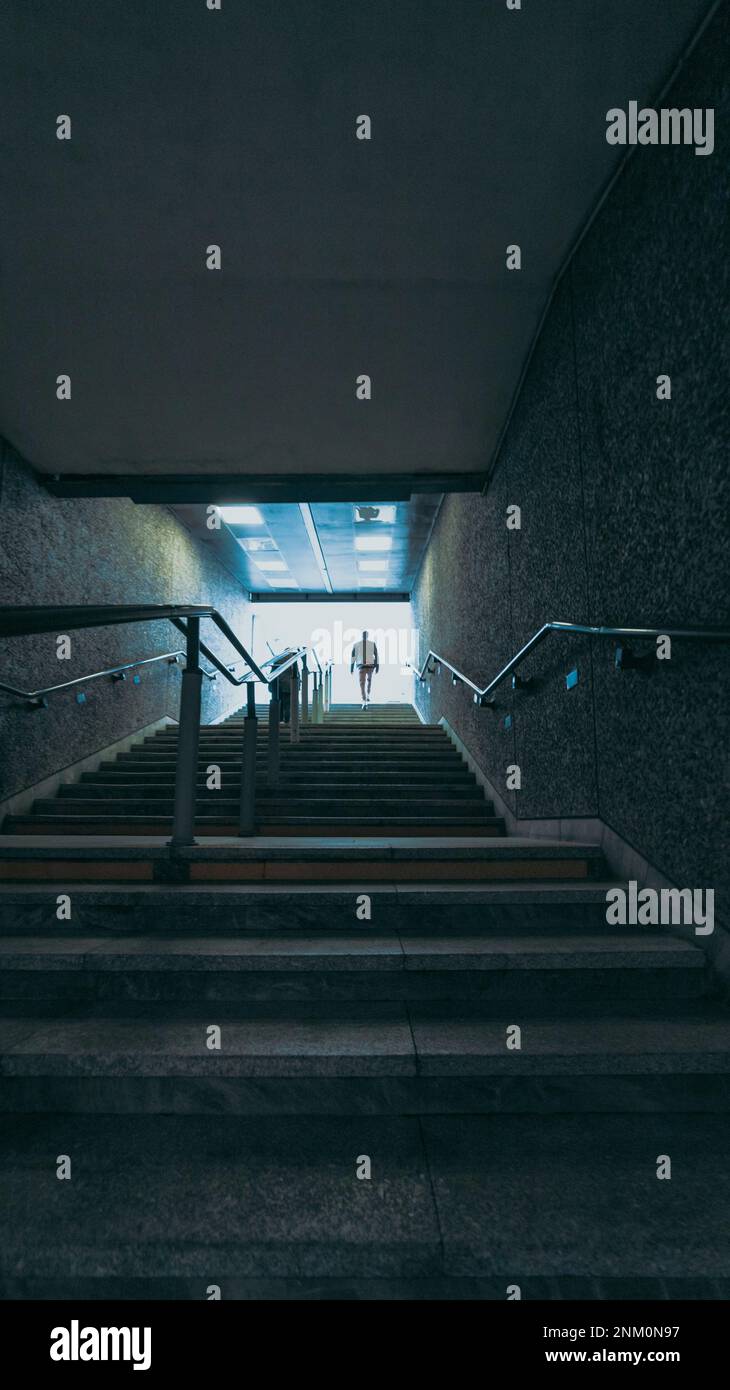 man on the stairs of underground tunnel Stock Photo - Alamy