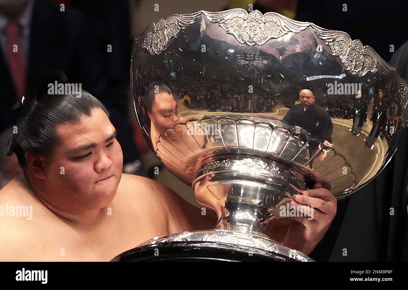 Sekiwake Mitakeumi receives the victory cup during the final day of ...