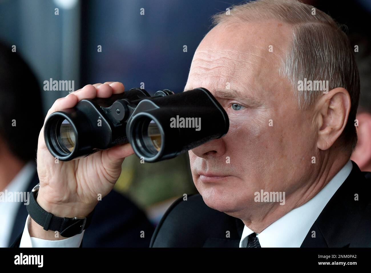 FILE - Russian President Vladimir Putin holds binoculars while watching ...