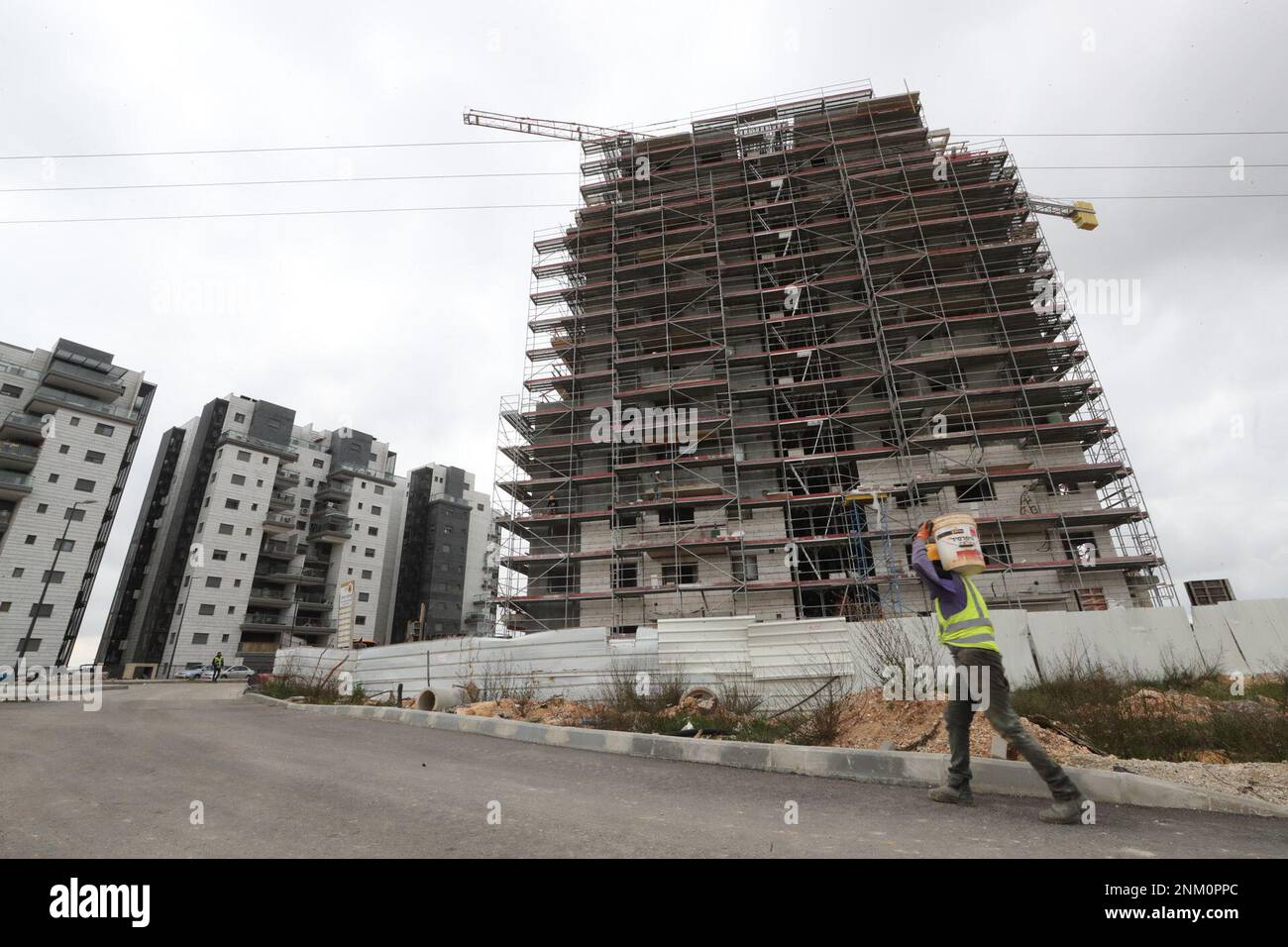 Jerusalem. 23rd Feb, 2023. A worker works at the Israeli settlement in ...