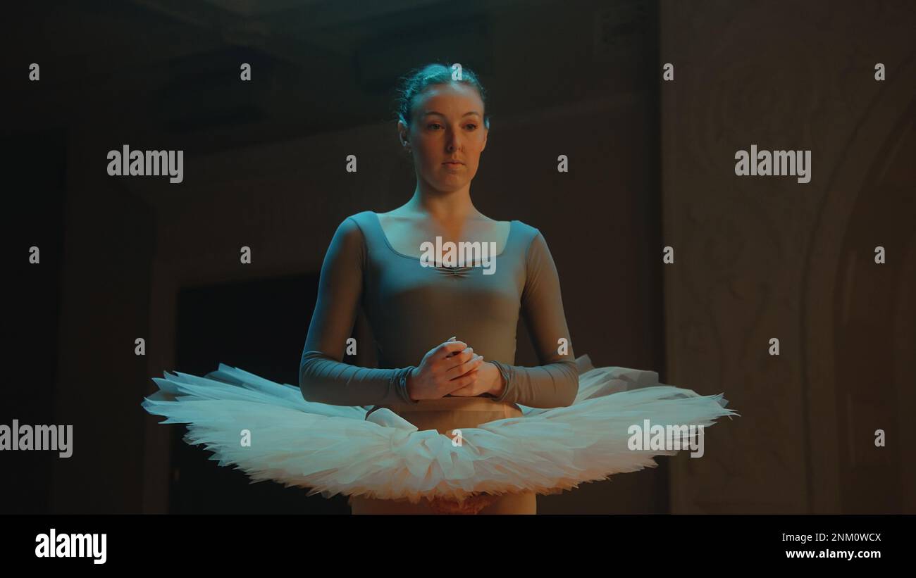 Cinematic shot of graceful ballerina in ballet dress standing in ...