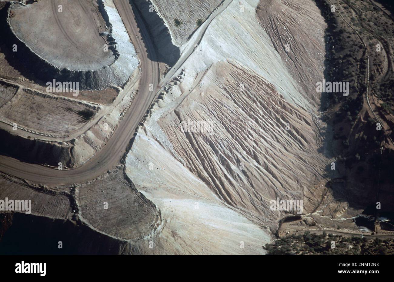1970s America: Aerial view of Erosion of tailings piles at Inspiration ...