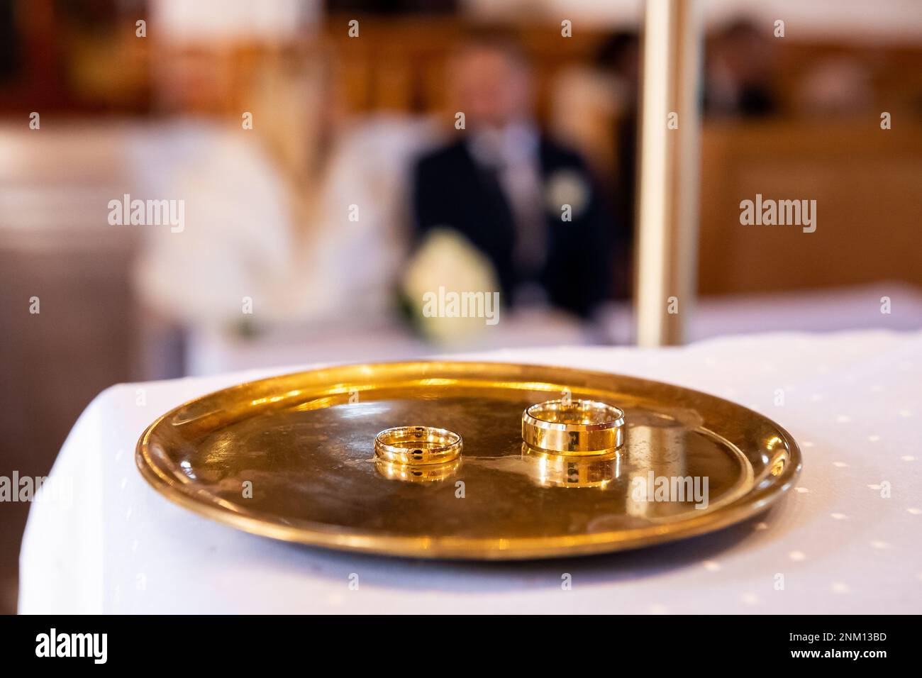 interiors and details in catholic church view of the altar, rings and ...