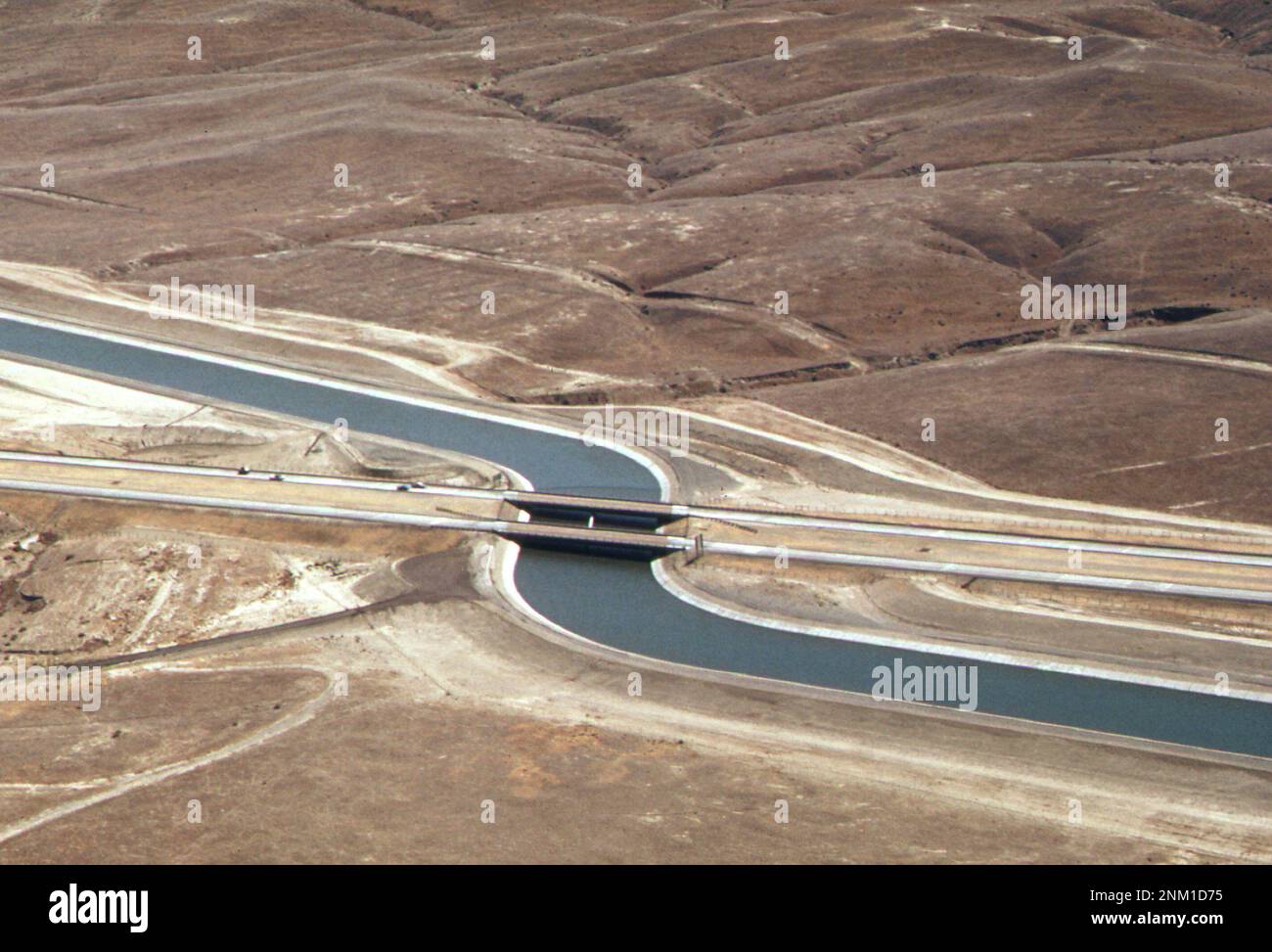 1970s United States: An aerial view of a highway running through the ...