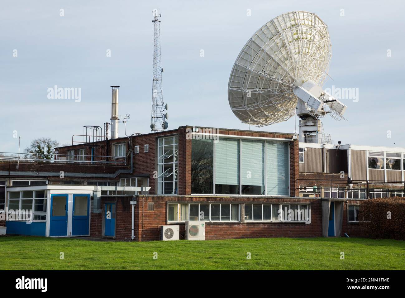 The control room (with the large windows protected by blinds) of the ...