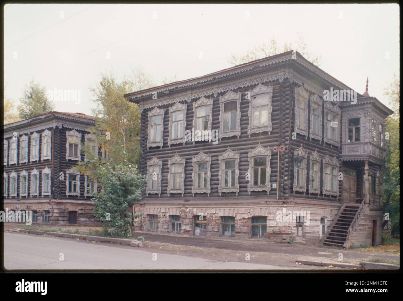 This image shows wooden houses along Aleksei Berents Street in Tomsk ...