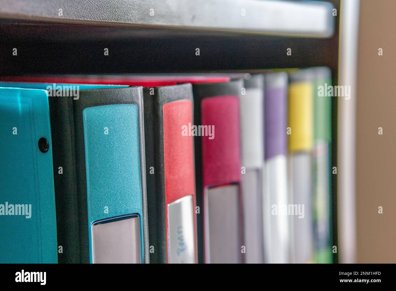 Collection of Color coded binders to keep documents Stock Photo - Alamy