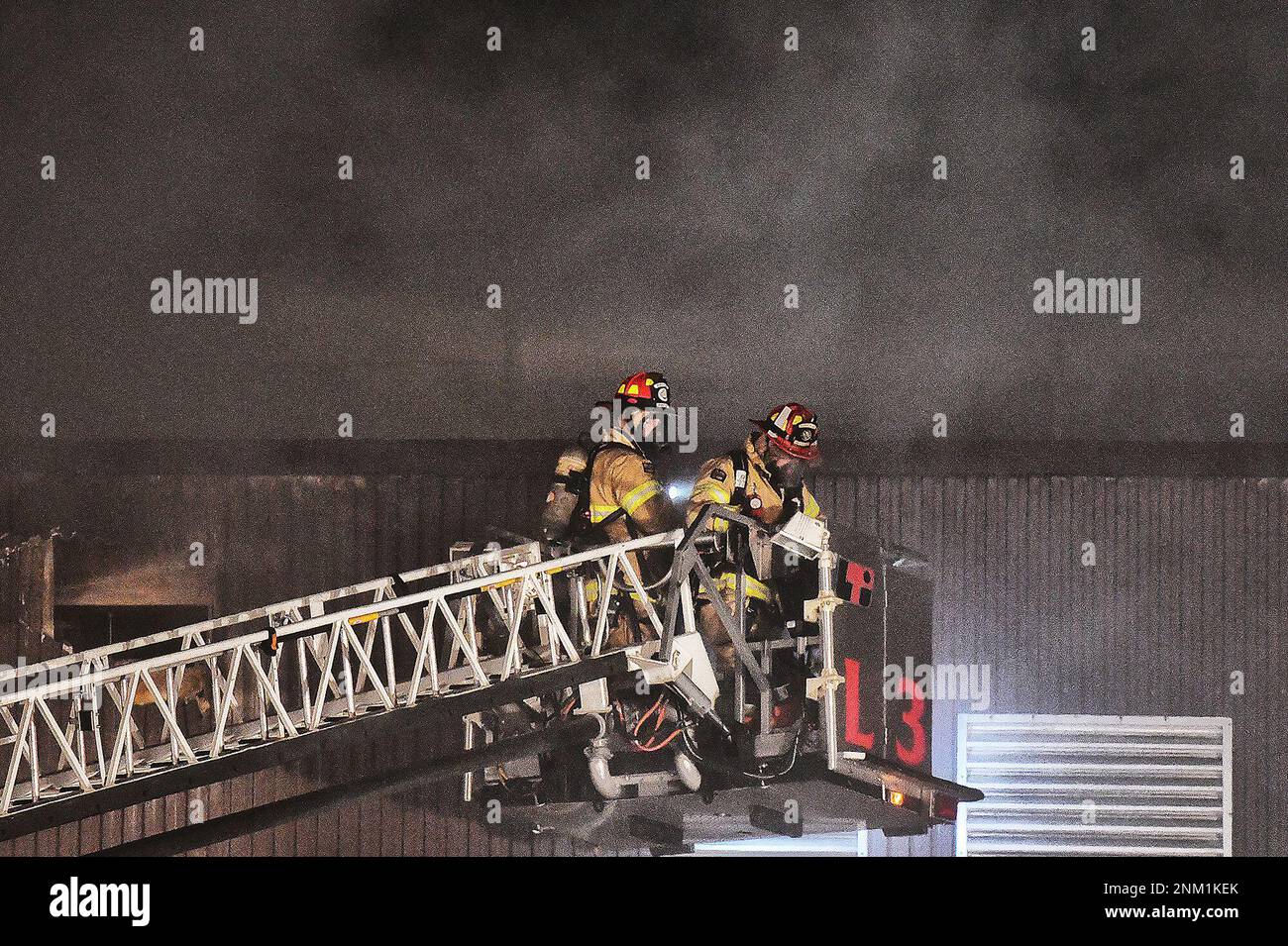 Firefighters battle a fire at the Offset Paperback facility in Dallas ...