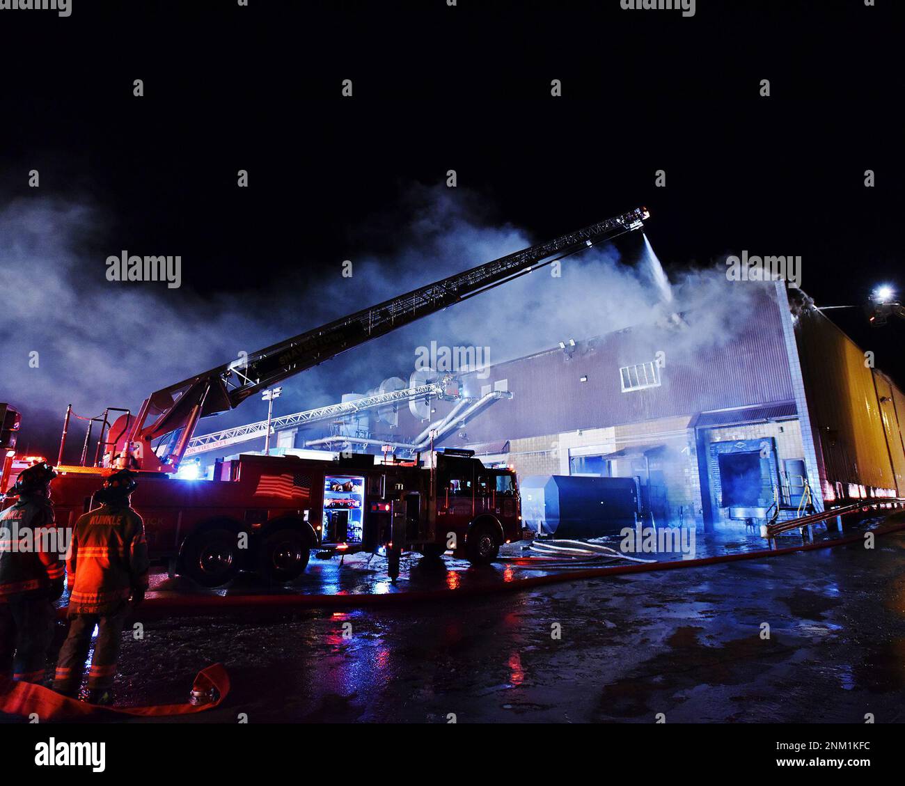 Firefighters battle a fire at the Offset Paperback facility in Dallas ...