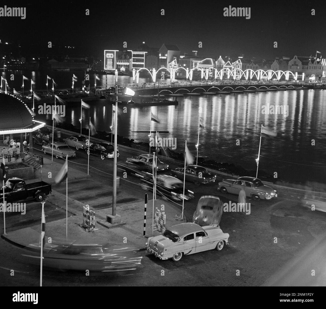 The illuminated Emma Bridge in Willemstad ca: October 1955 Stock Photo ...
