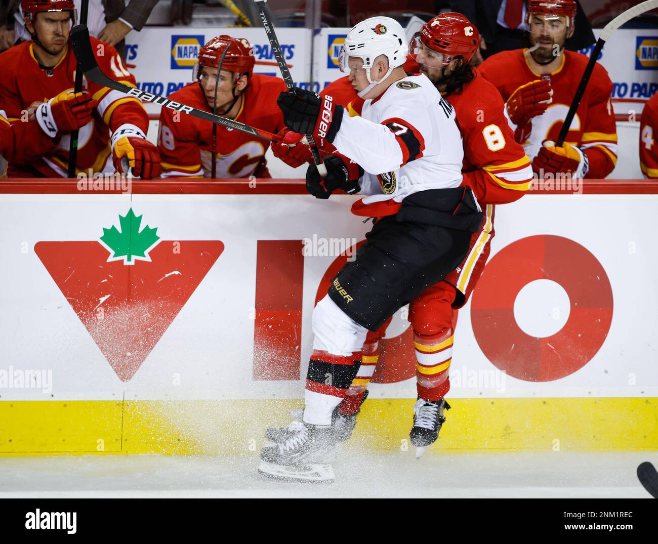 Ottawa Senators' Brady Tkachuk, left, checks Calgary Flames ...