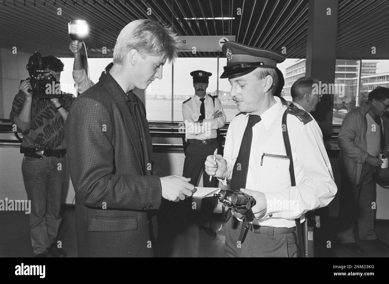 Footballer Wim Kieft arrives at Schiphol, signs an autograph in the ...