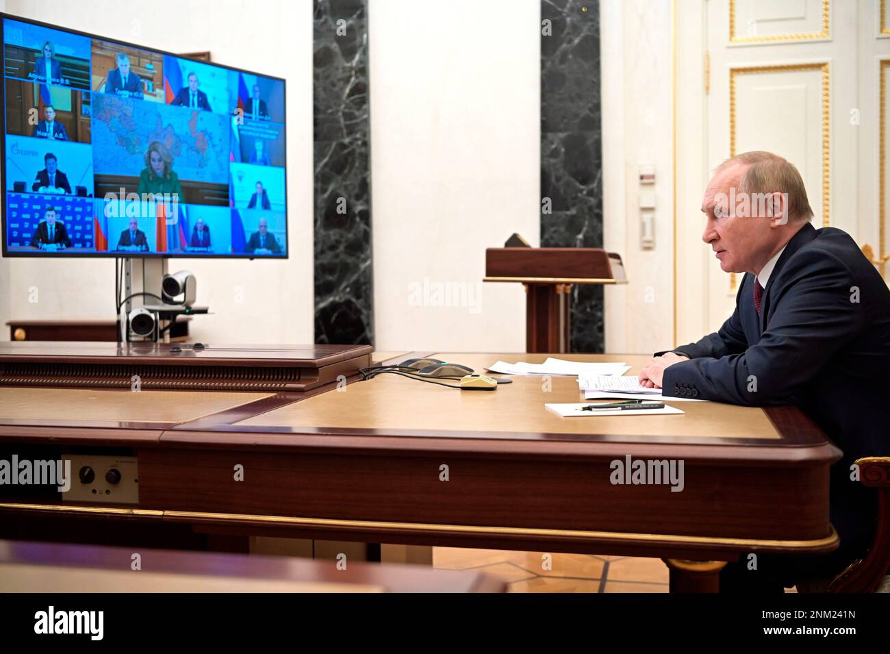 Russian President Vladimir Putin attends a cabinet meeting via a ...