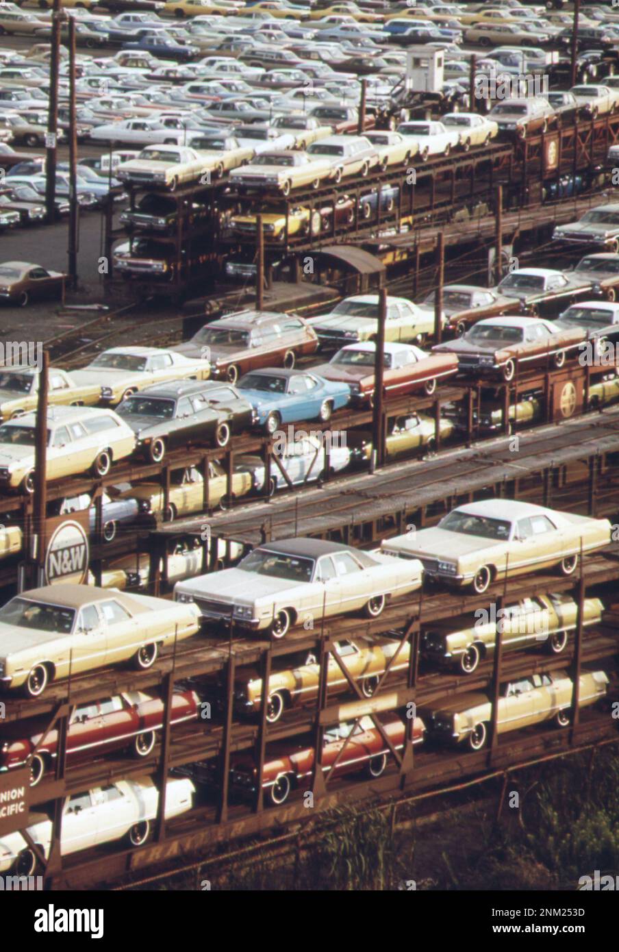 1970s America: New cars are loaded onto railroad cars at Lasher and I ...