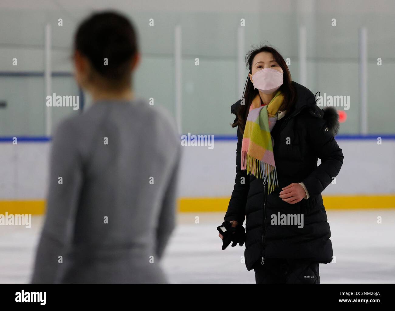 Japanese figure skating coach Mie Hamada gives Mana Kawabe guidance in ...