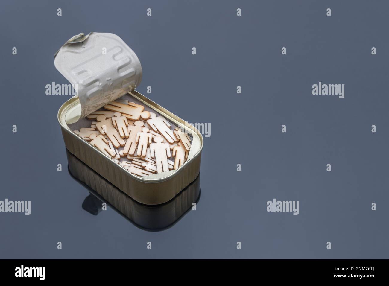 Male laser-cut wooden figures squashed into a sardine tin. Possibly for ...