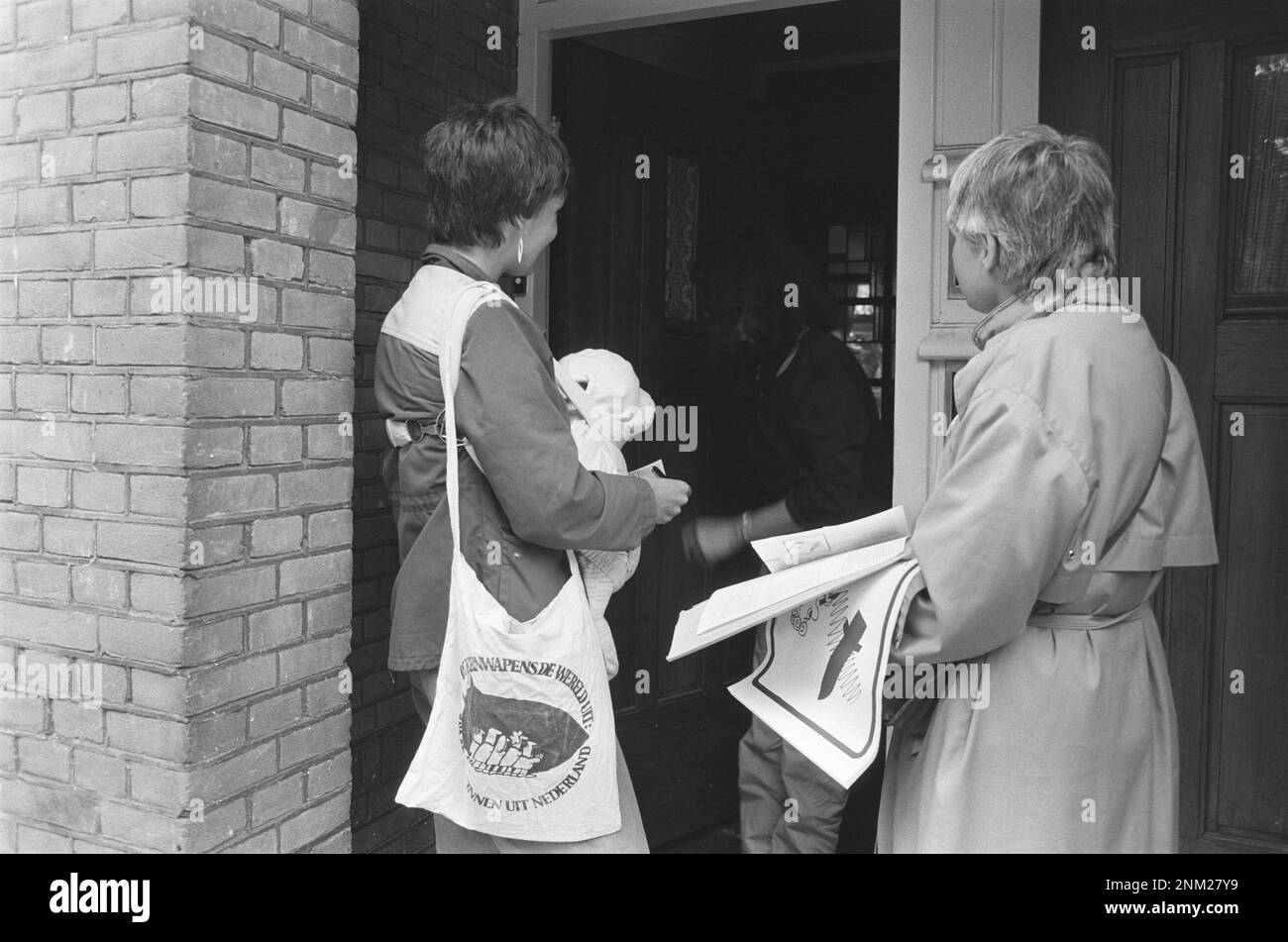 A woman collecting signatures for the people's petition ca. 1985 Stock ...