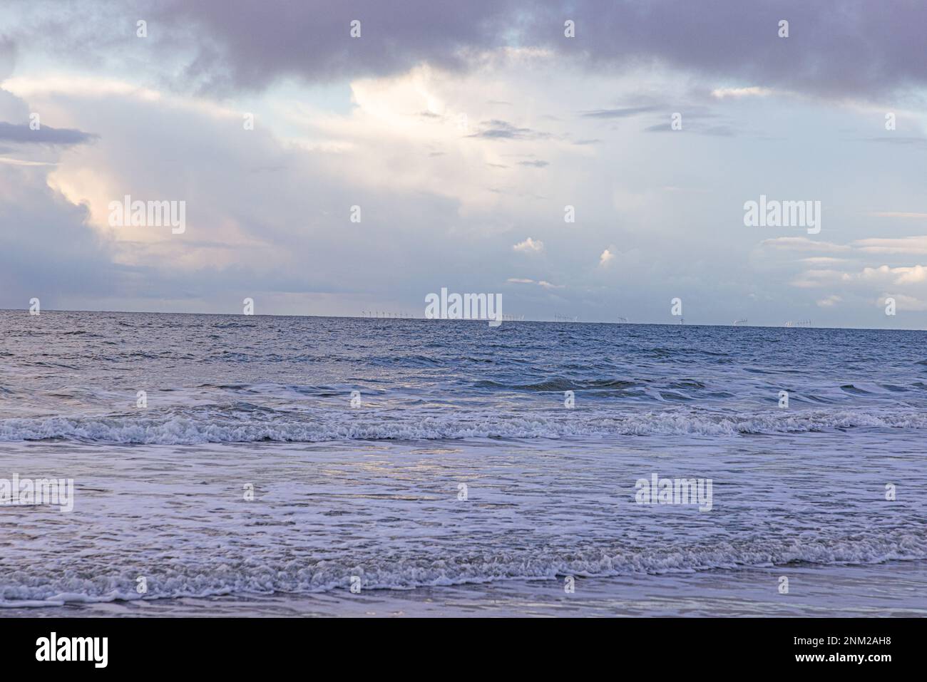 Picture of a wind farm in stormy north sea photographed from Skallingen ...