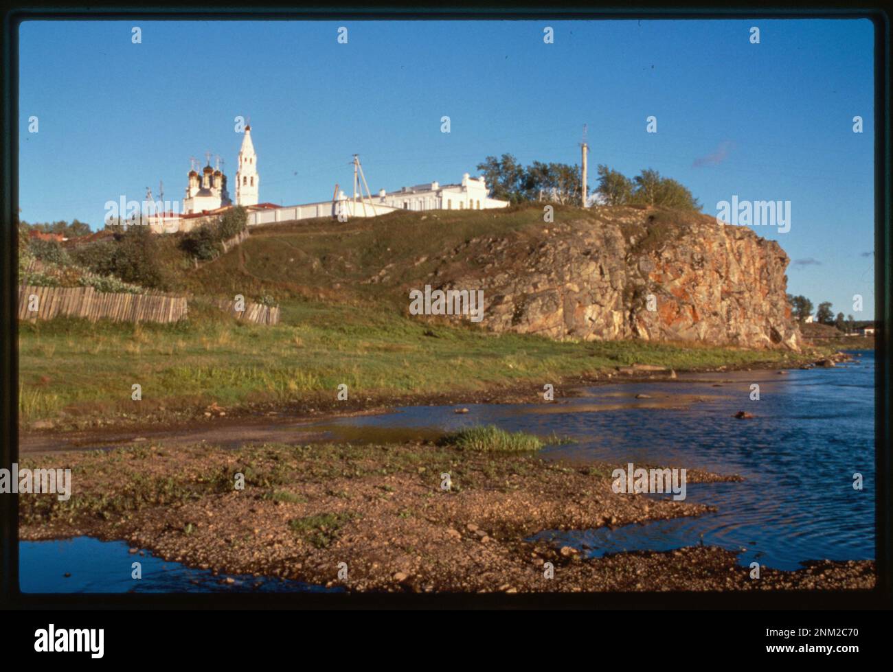 This panoramic view of the Tura River, with Trinity Rock and the Church ...