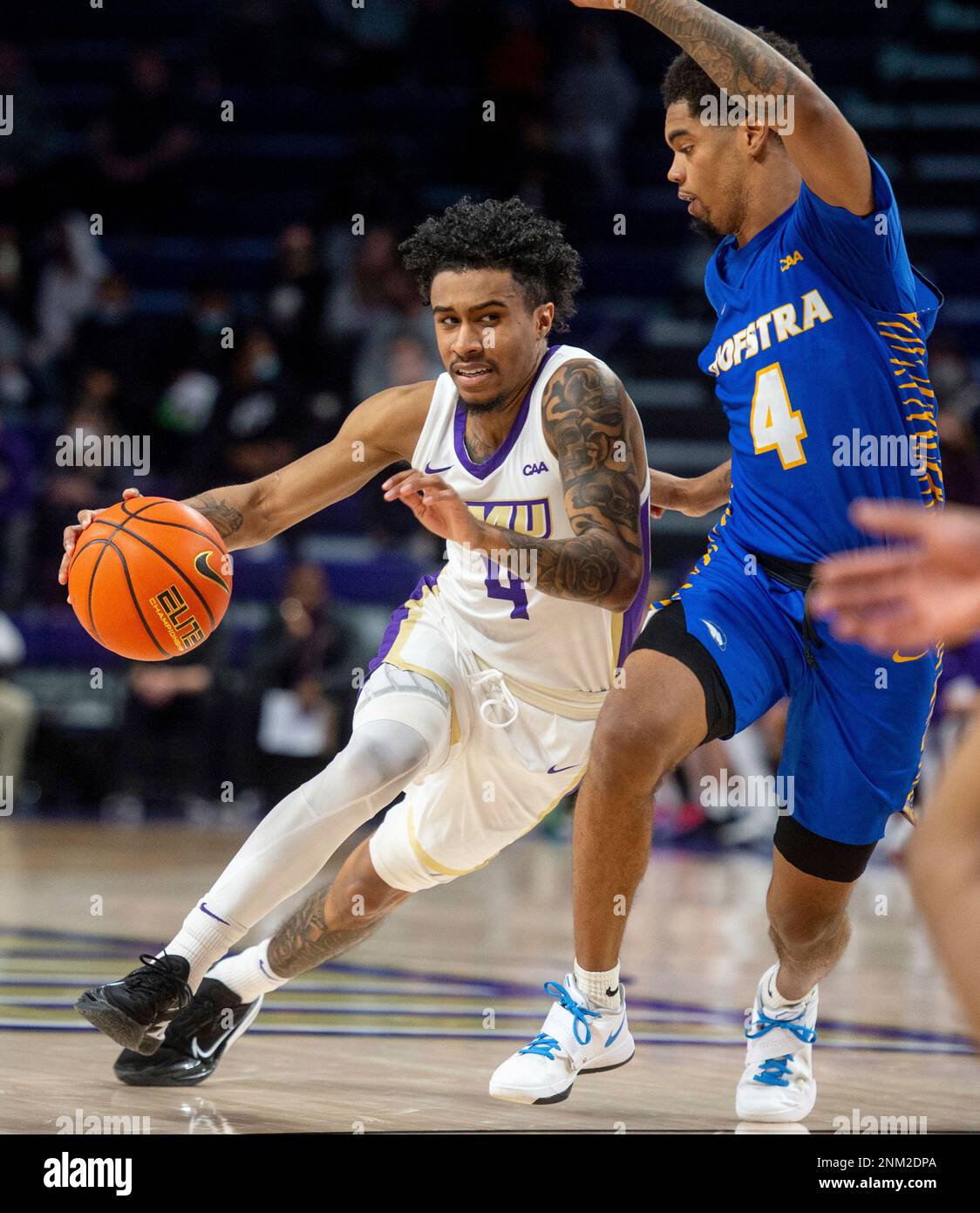 James Madison guard Vado Morse (4) drives up the court against Hofstra ...