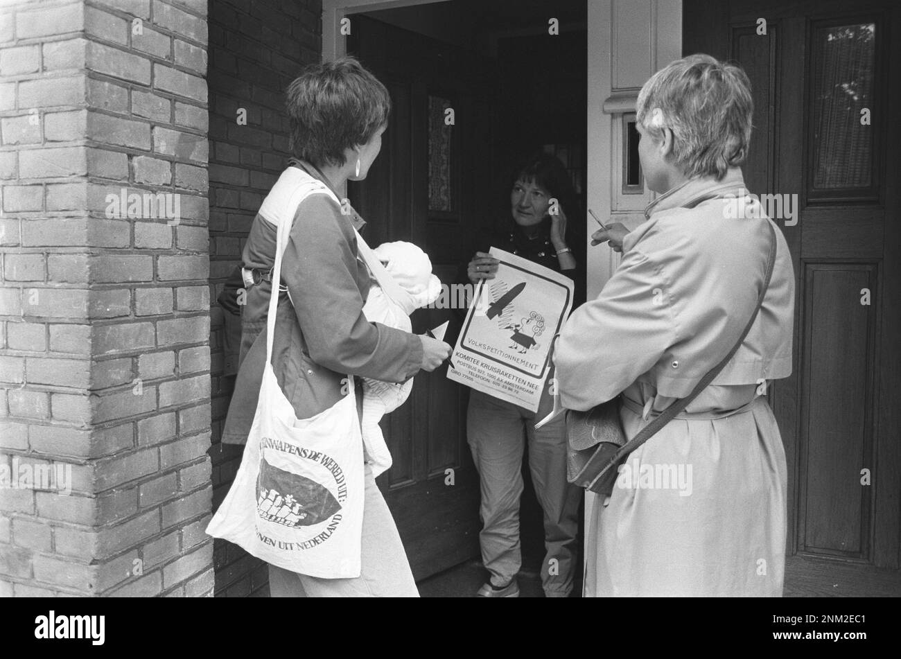 A woman collecting signatures for the people's petition ca. 1985 Stock ...