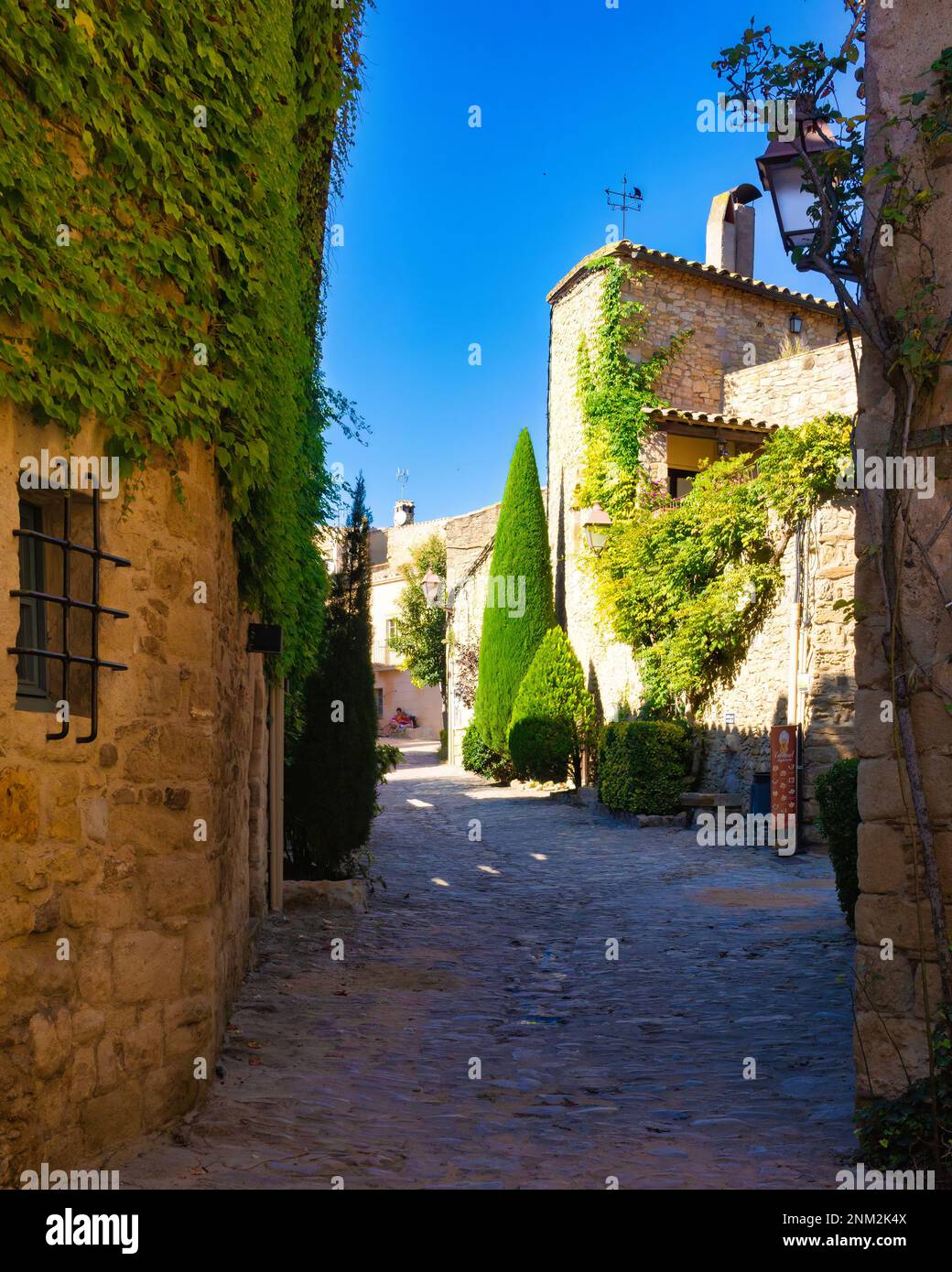 Street of the historic center of Peratalla with arches. Peratallada ...