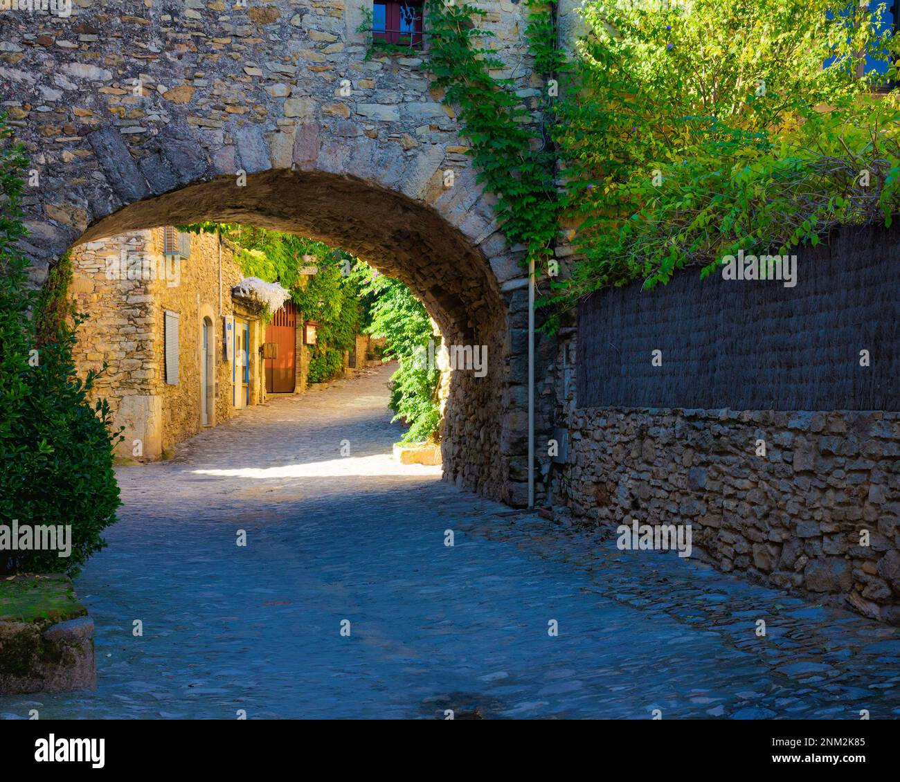 One of the streets of the historic center of Peratalla with arches ...