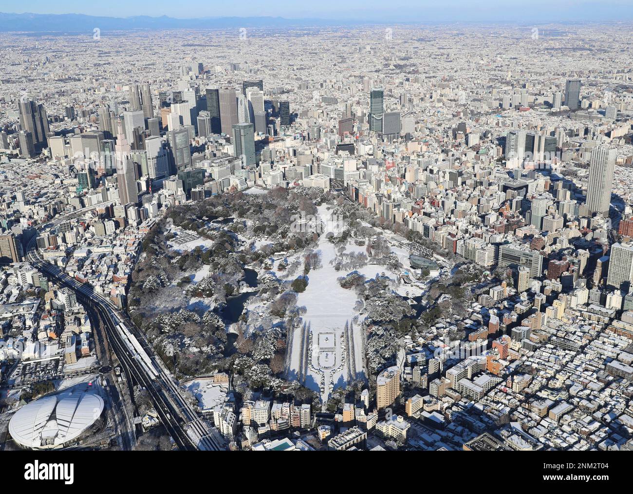 An aerial photo shows Shinjuku Gyoen National Garden and buildings ...
