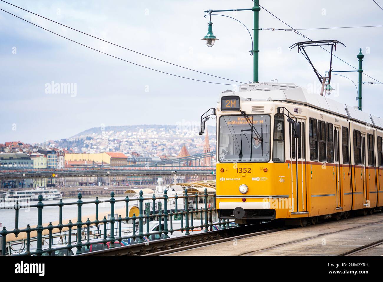 Famous yellow retro Tram line number 2 along Danube river in Budapest ...