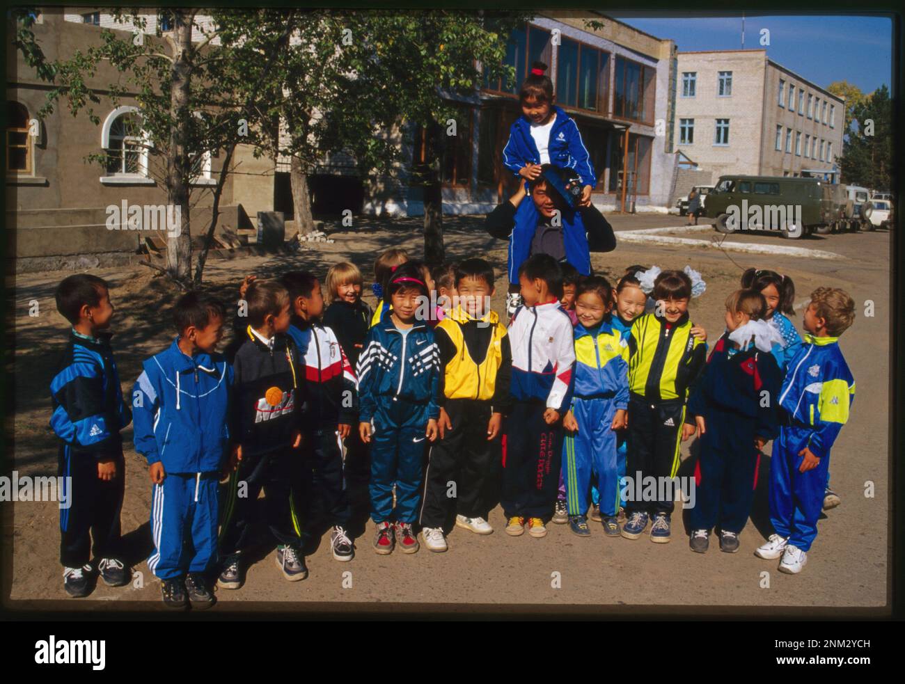 A group of school children with their teacher in Aginskoe, Russia. This ...