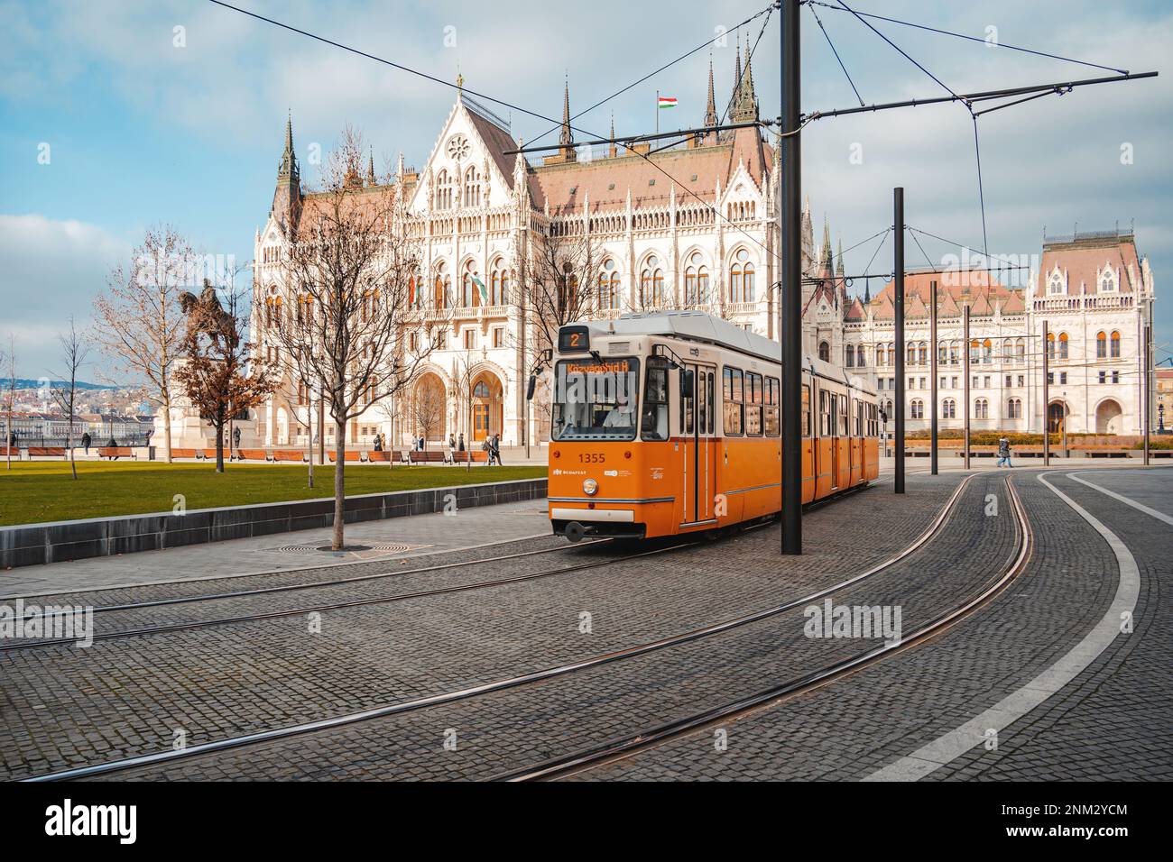 Famous yellow retro Tram line number two goes by Hungarian Parliament ...