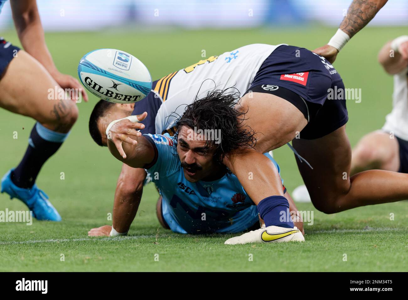 Charlie Gamble of the Waratahs is tackled during the Super Rugby ...