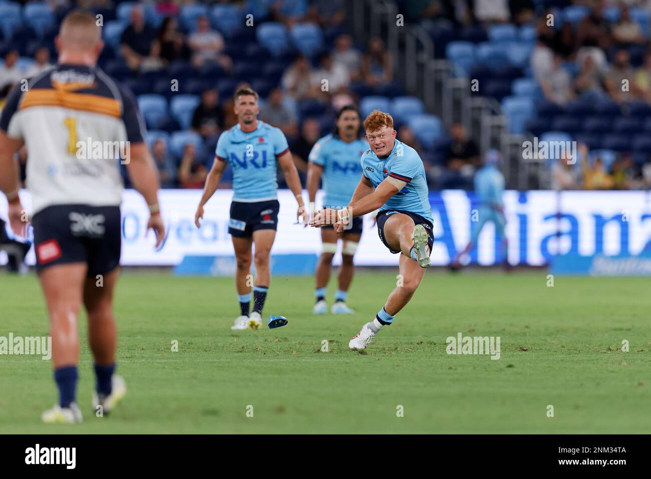 Tane Edmed of the Waratahs kicks the ball during the Super Rugby ...