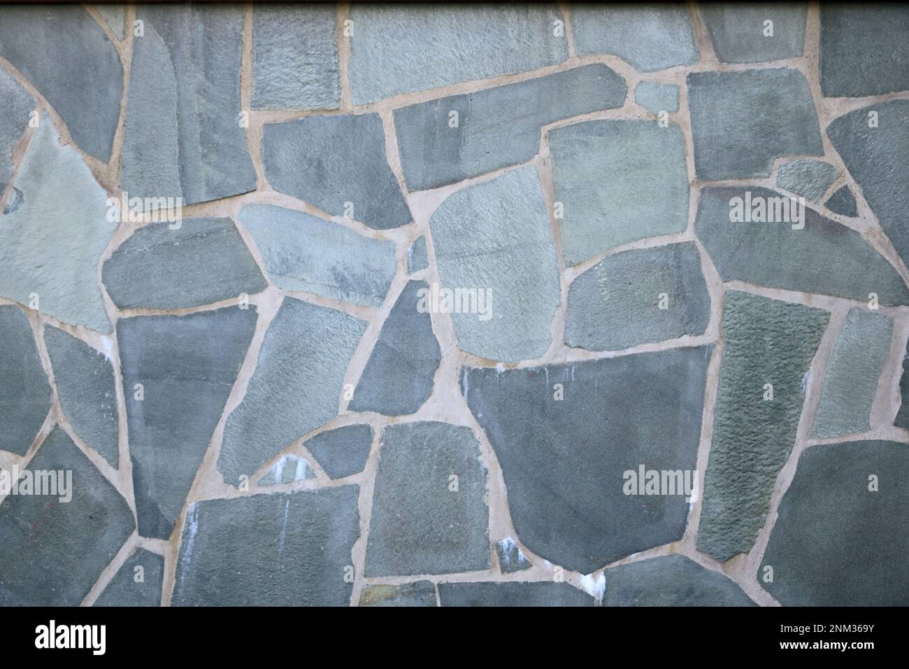 a olive green stone slabs wall Stock Photo - Alamy