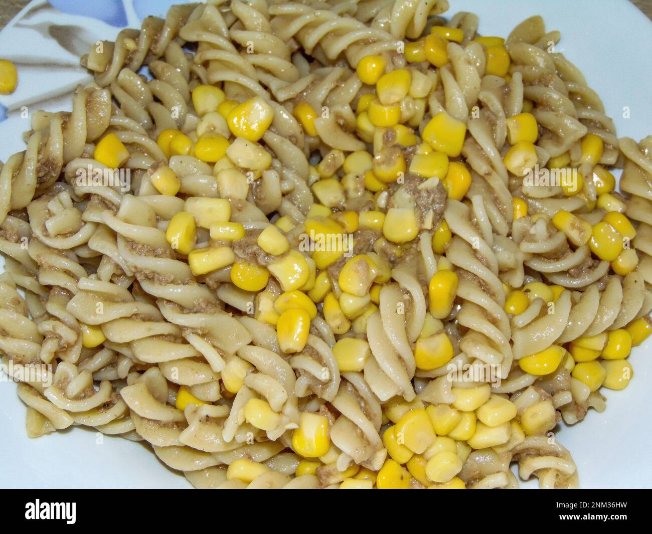 pasta with shredded tuna and corn kernels - food Stock Photo - Alamy