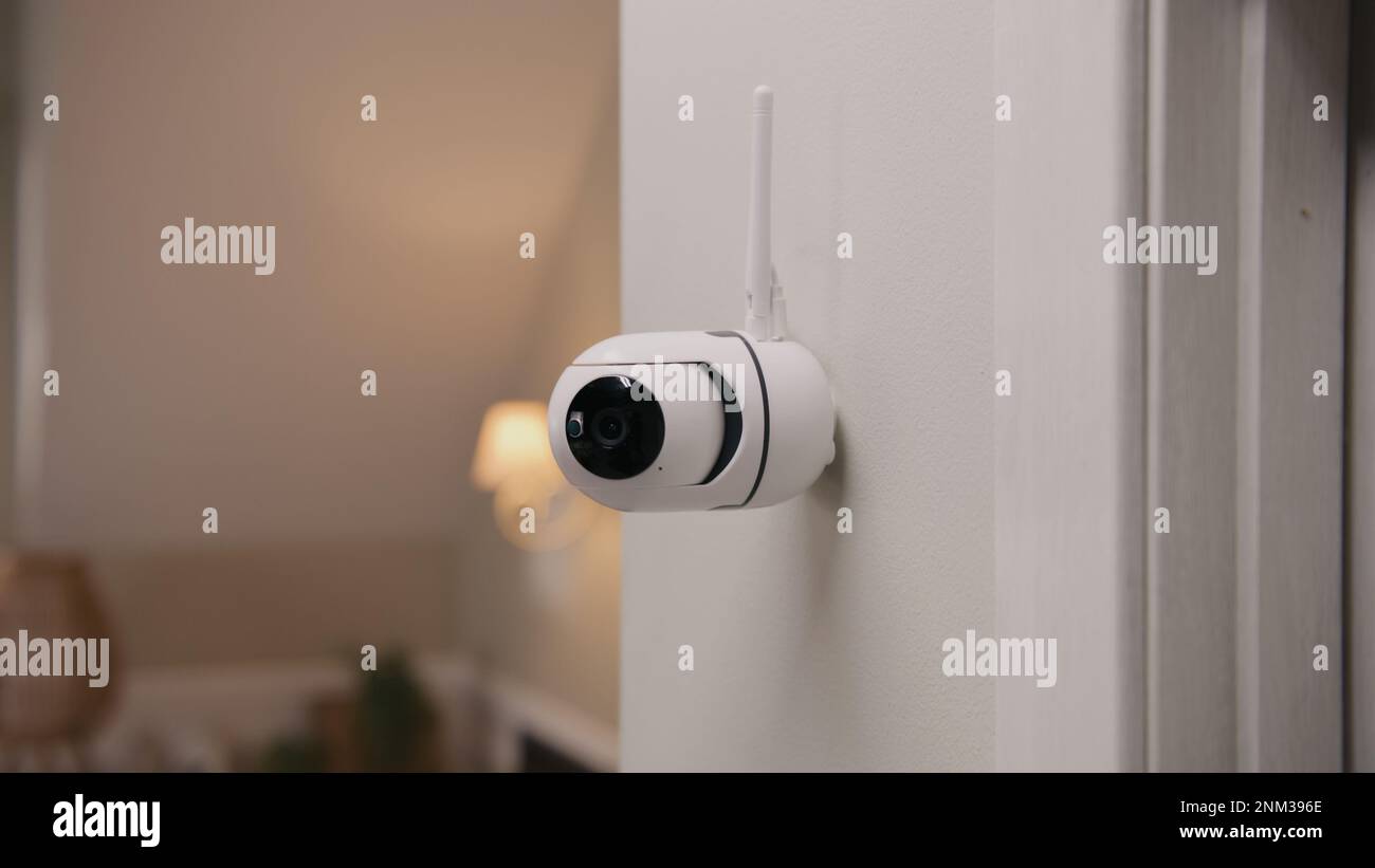 Close up shot of installed security camera on wall in modern apartment ...
