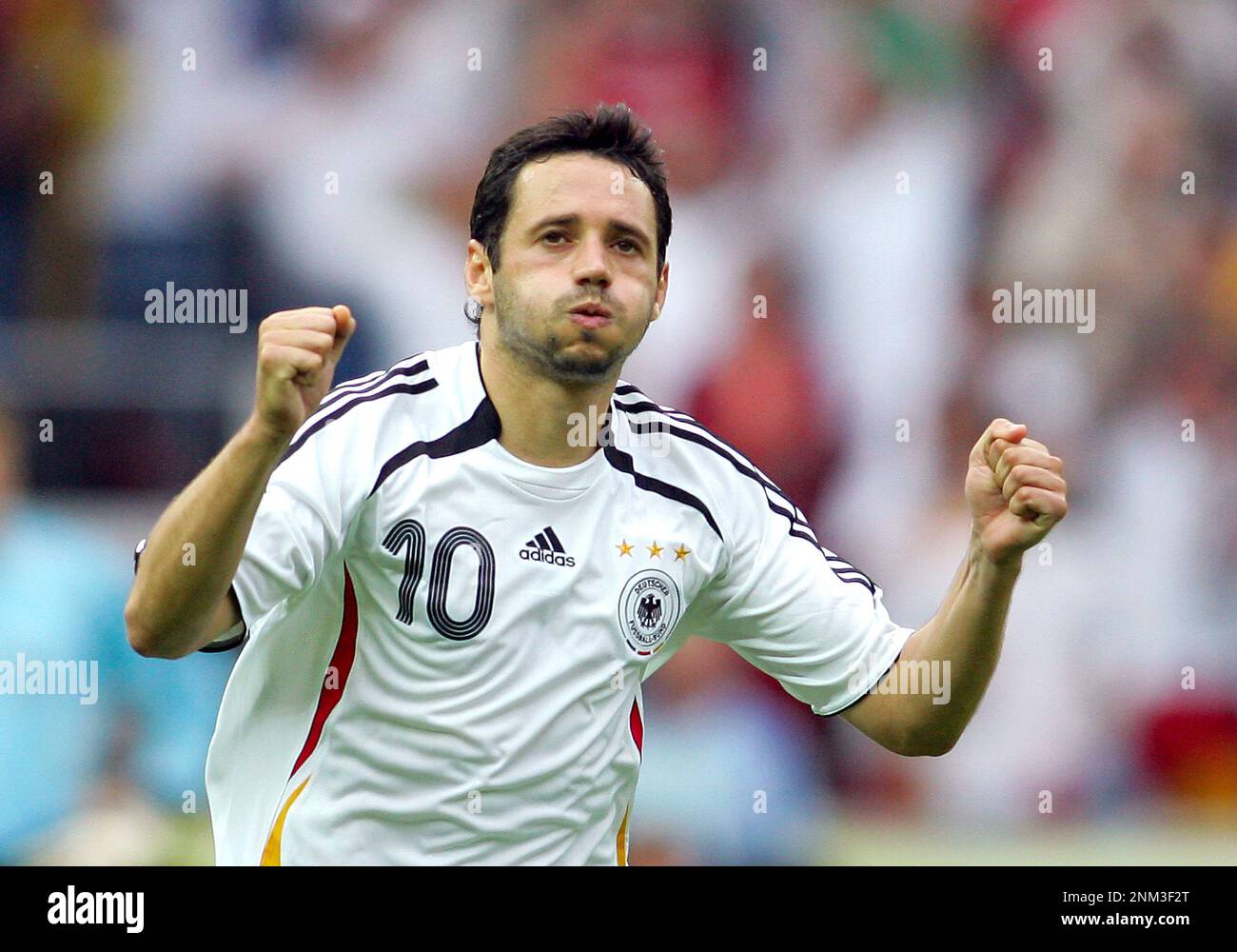 Oliver Neuville of Germany after scoring in the penalty shootout ...