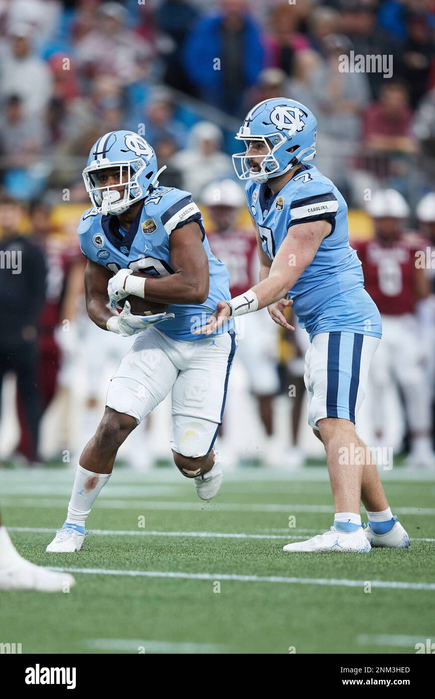North Carolina Tar Heels running back Ty Chandler (19) takes a hand-off ...