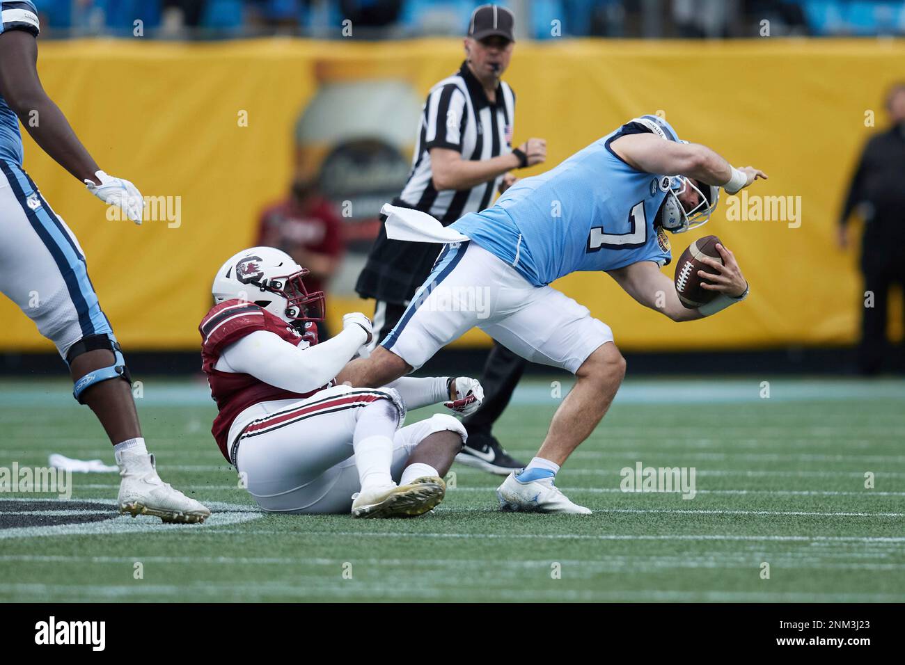 North Carolina Tar Heels quarterback Sam Howell (7) is tackled by South ...
