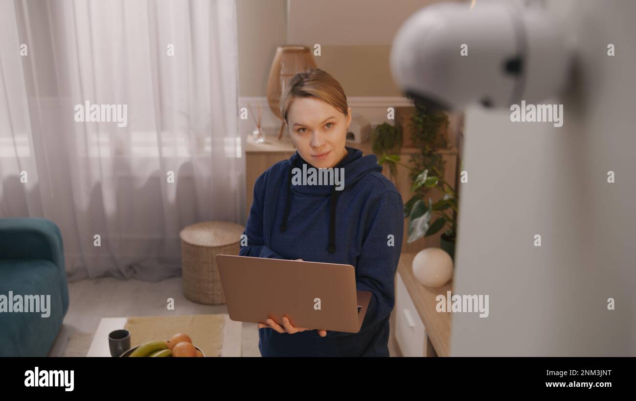 Caucasian Woman Installs Security Camera Woman Sets Up Angle Of Cctv