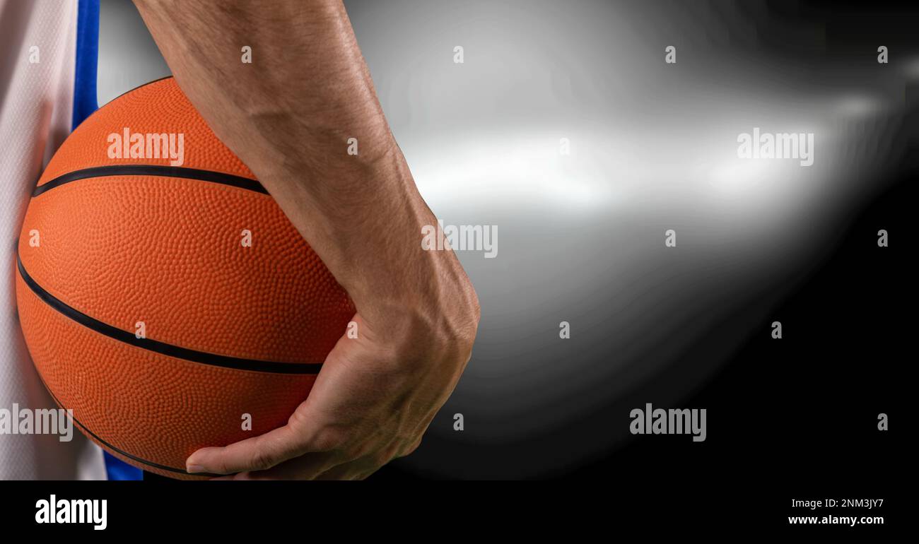 Composition of midsection of male basketball player with ball ...