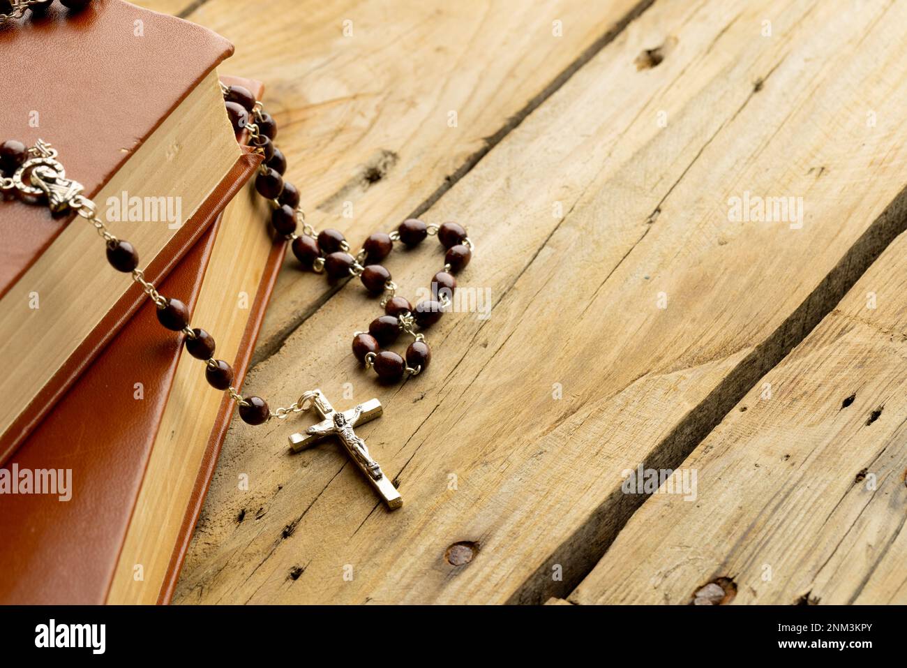 Image of close up of two holy bibles with rosary and copy space on ...