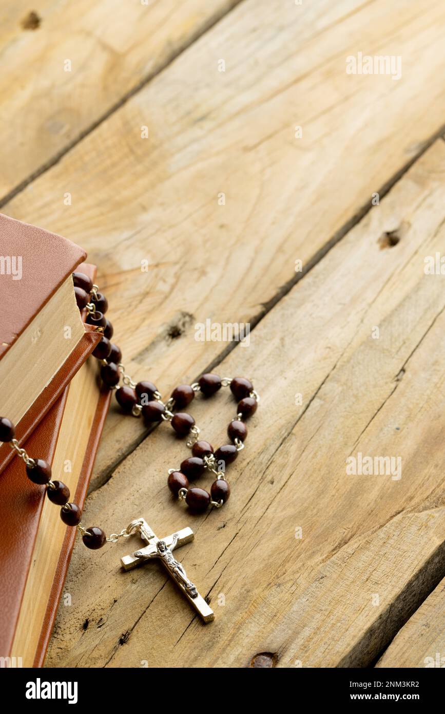 Image of close up of two holy bibles with rosary and copy space on ...