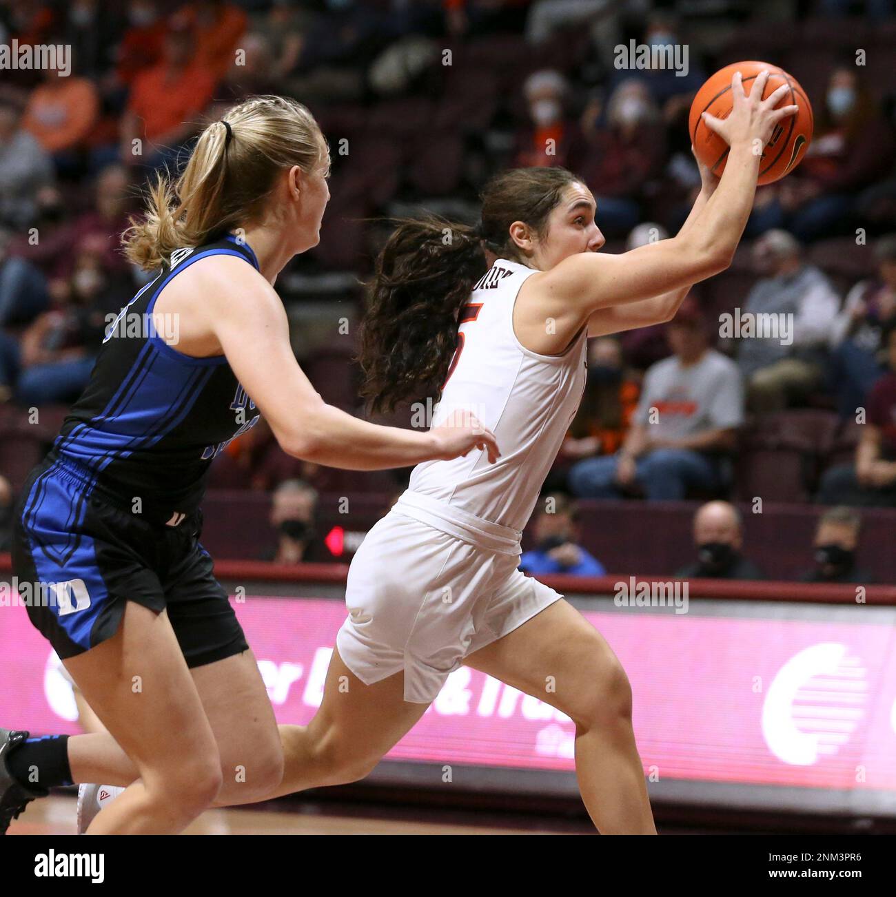 Virginia Tech's Georgia Amoore (5) drives past Duke's Lee Volker (13 ...