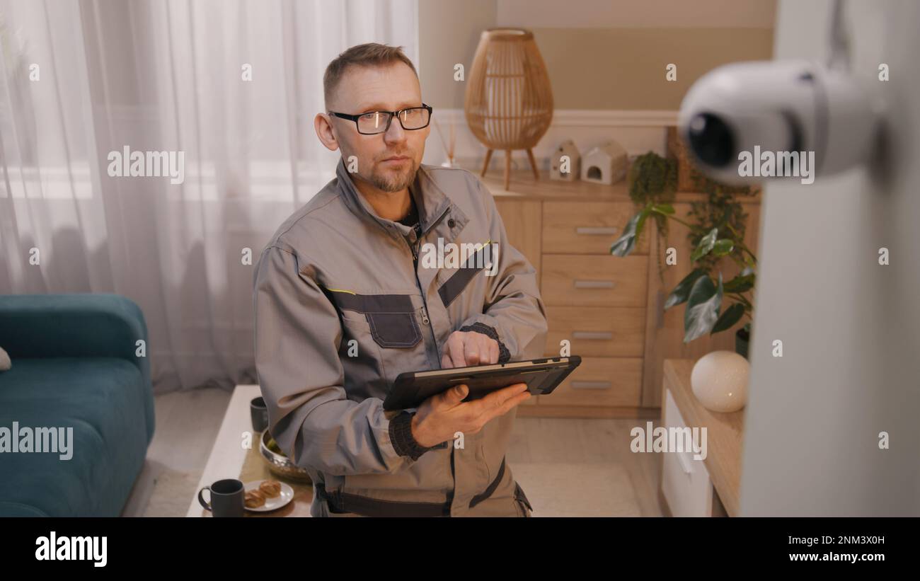 Male installer in uniform sets hi-res stock photography and images - Alamy