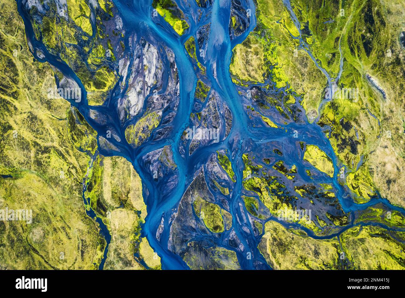 Top view of abstract blue glacier rivers pattern flowing through ...
