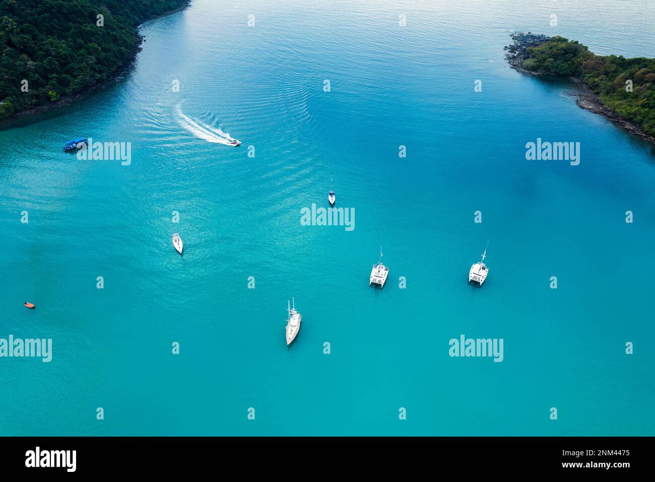 Aerial view of yacht sightseeing sailing on tropical sea in summer ...