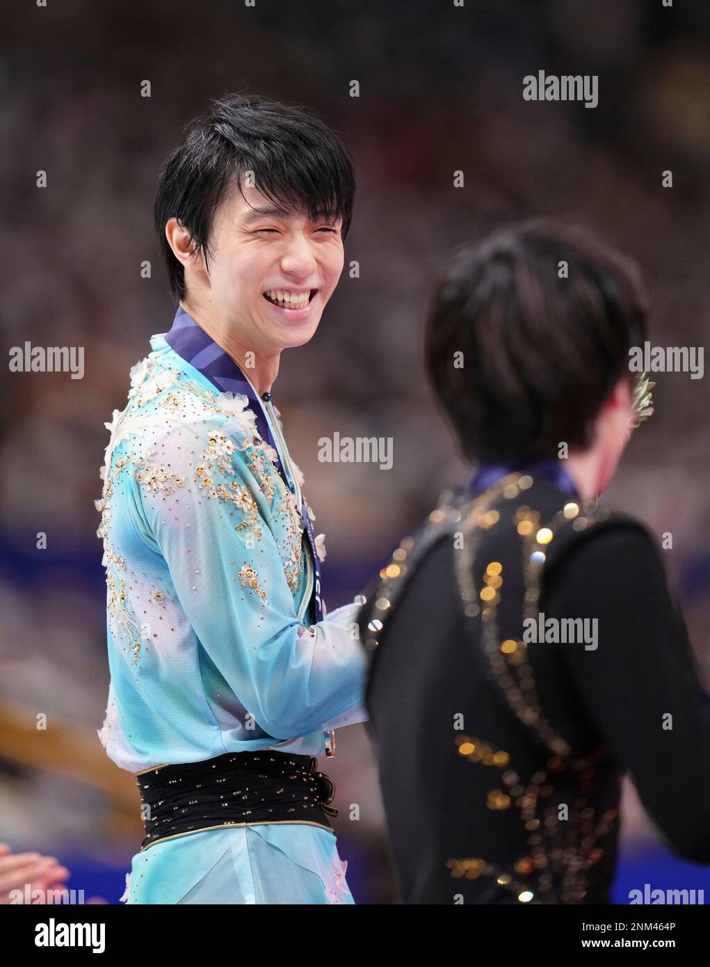 Japanese figure skater Yuzuru Hanyu celebrates during an award ceremony ...
